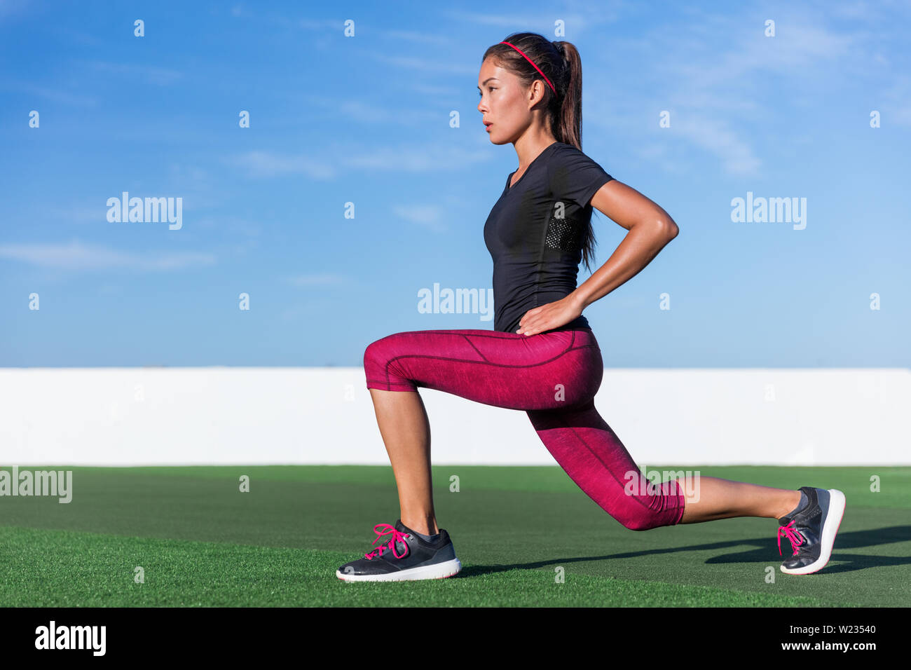 Fitness woman doing lunges exercises for glute and leg muscle workout training core muscles ...