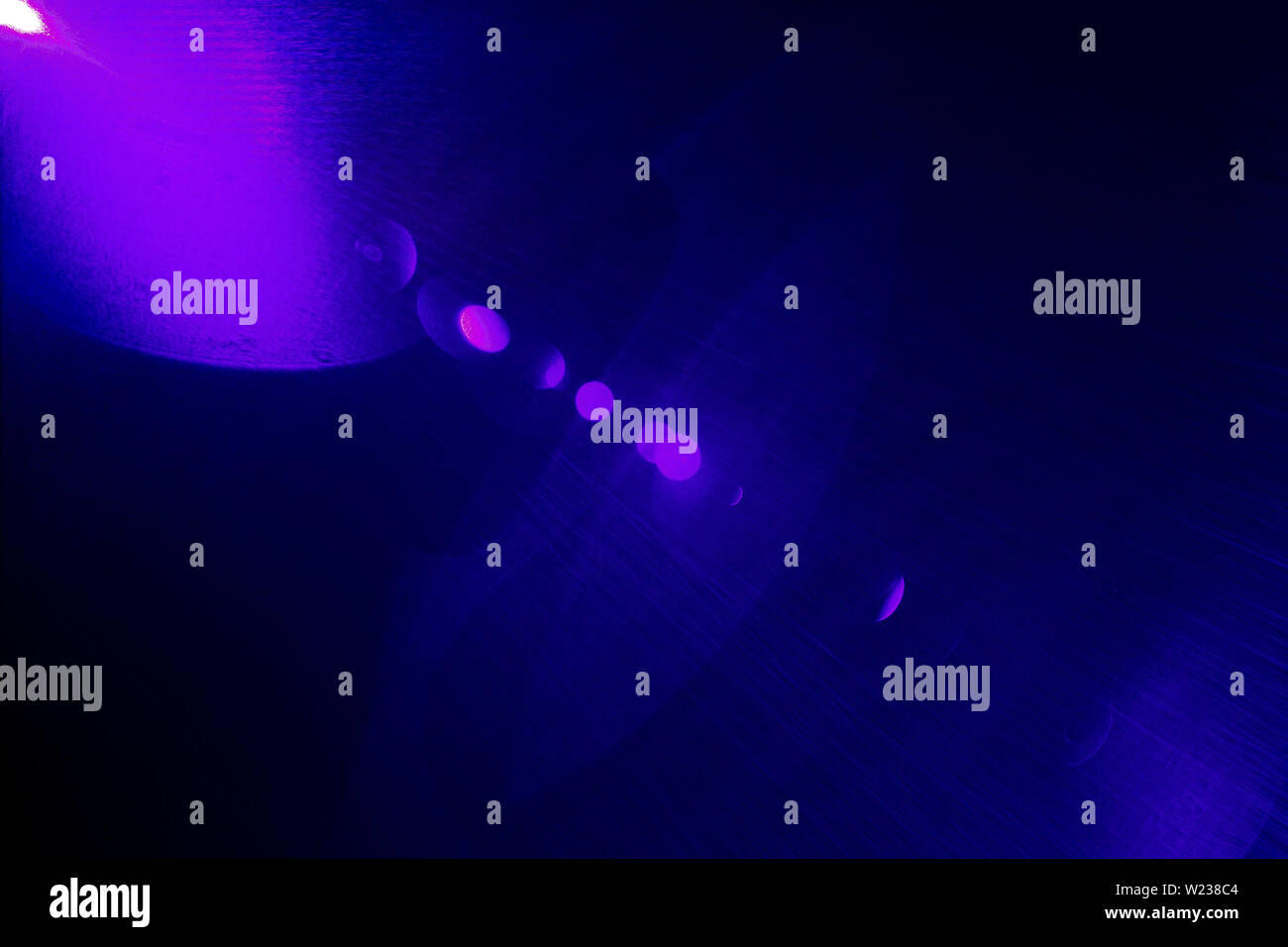 Camera lens flare by laser light create circles of objective and ...