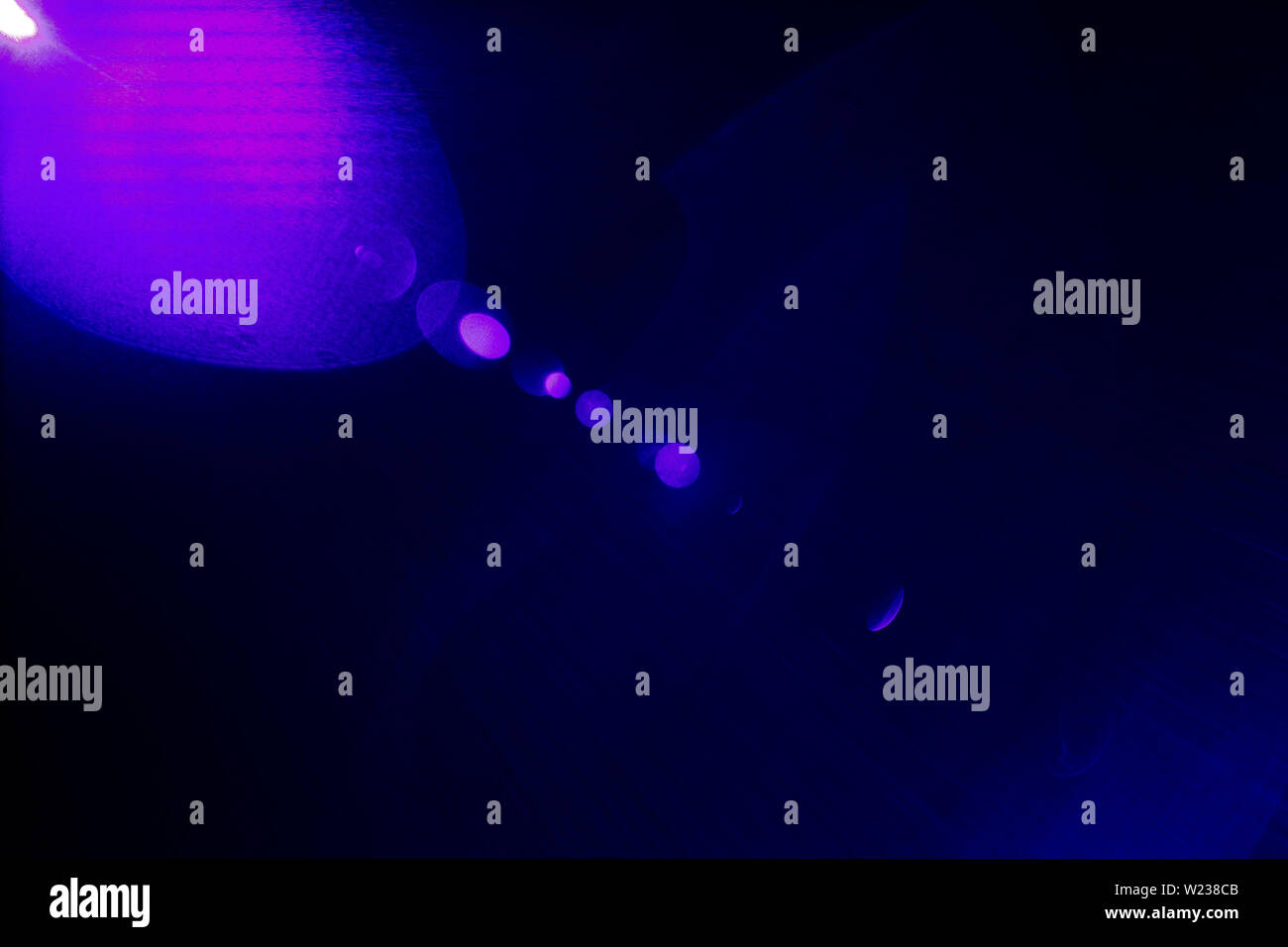 Camera lens flare by laser light create circles of objective and ...