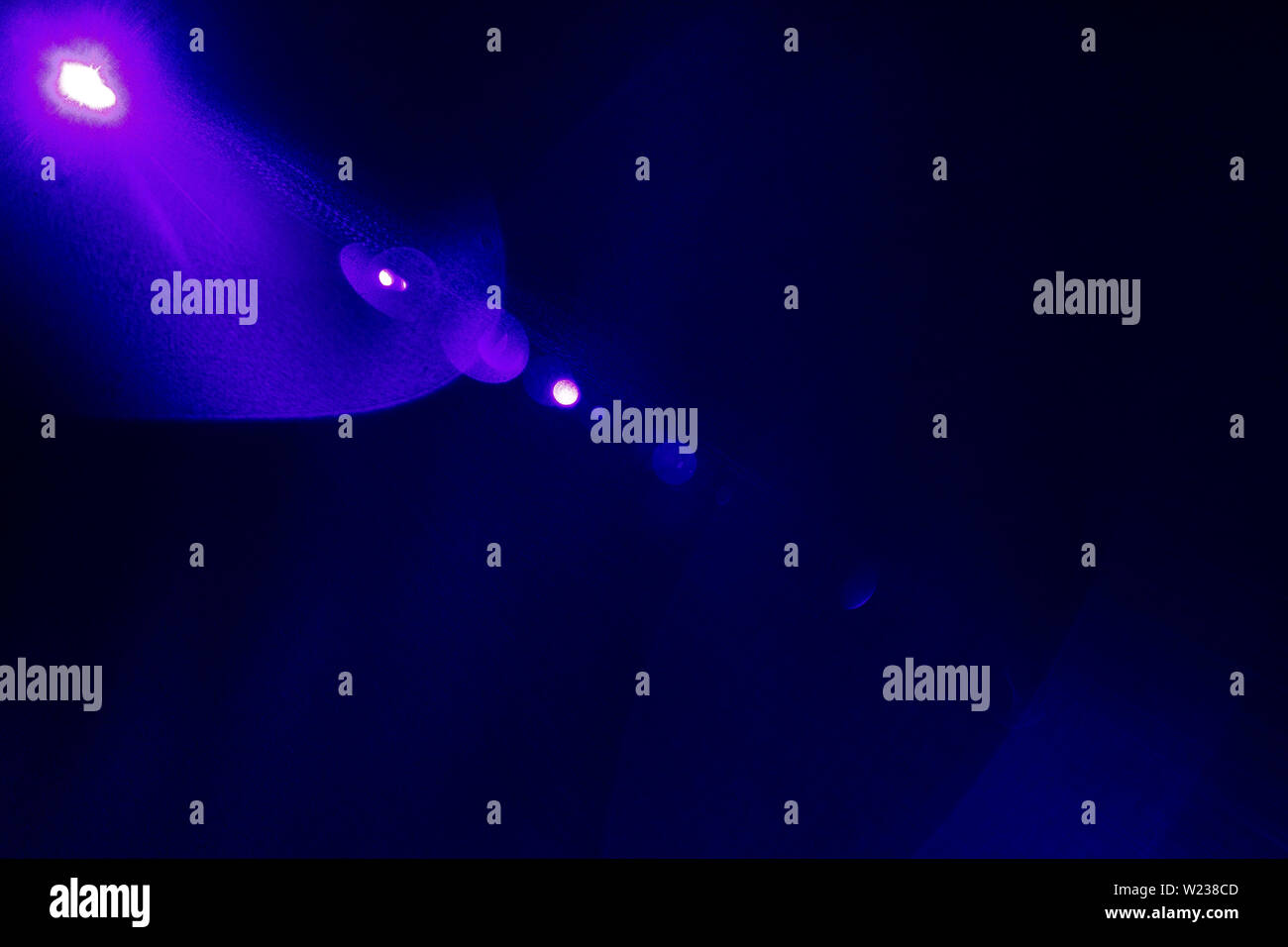 Camera lens flare by laser light create circles of objective and ...