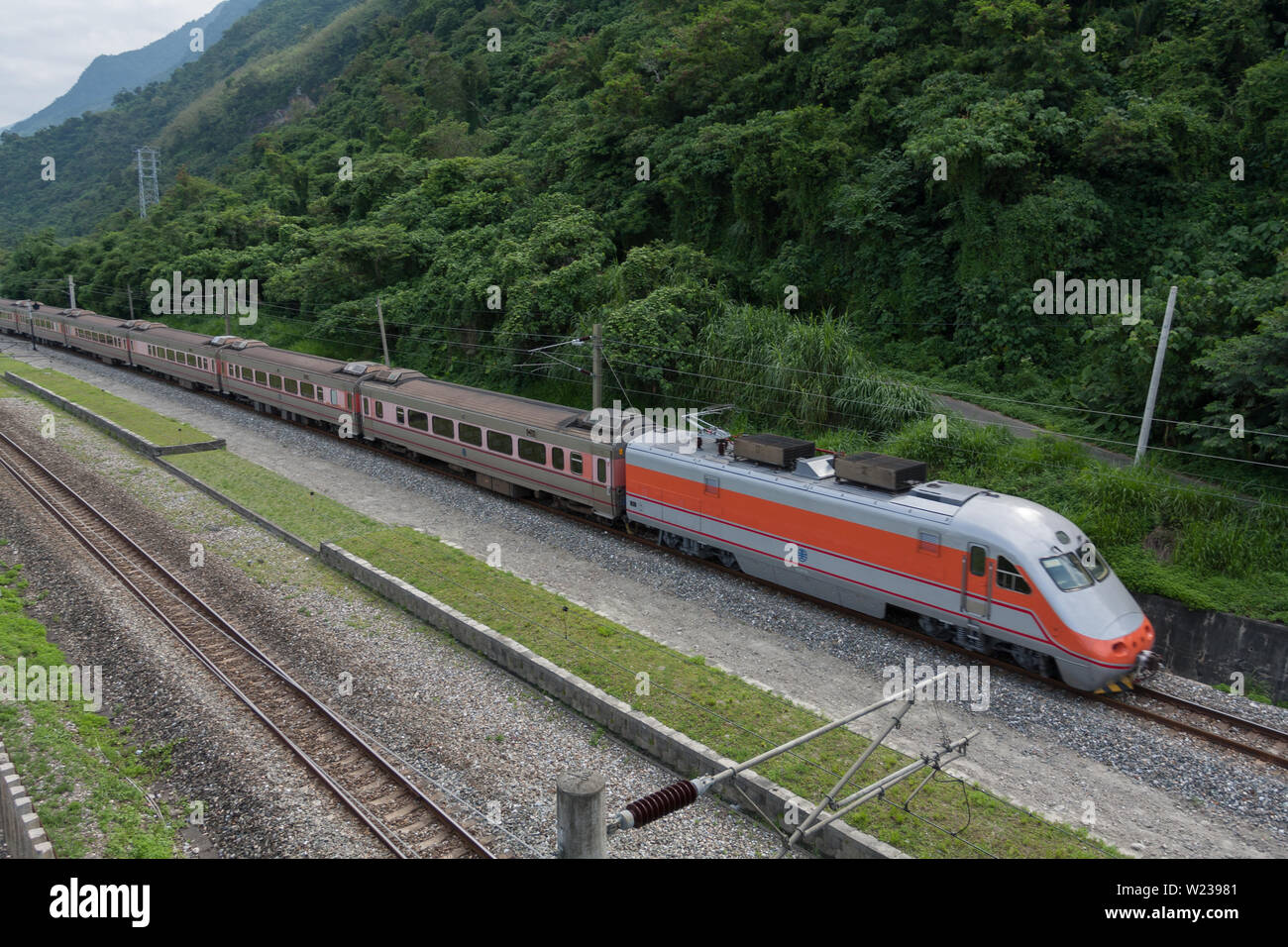 Taiwan Railway - TzeChiang Limited Express, a passing passenger train ...