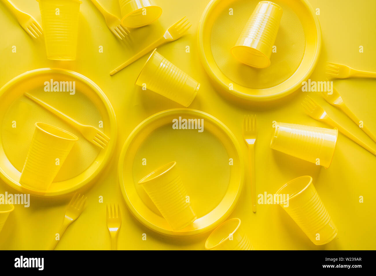Yellow disposable picnic utensils. Environment , eco friendly discarded ...