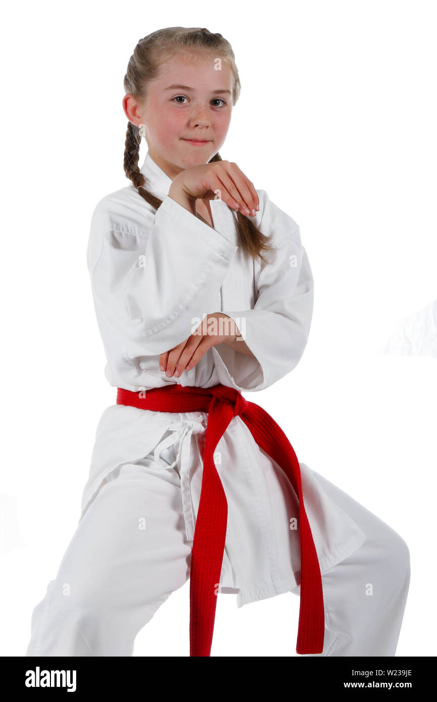 Pre-teen caucasian girl wearing a karate uniform doing a kata Stock ...