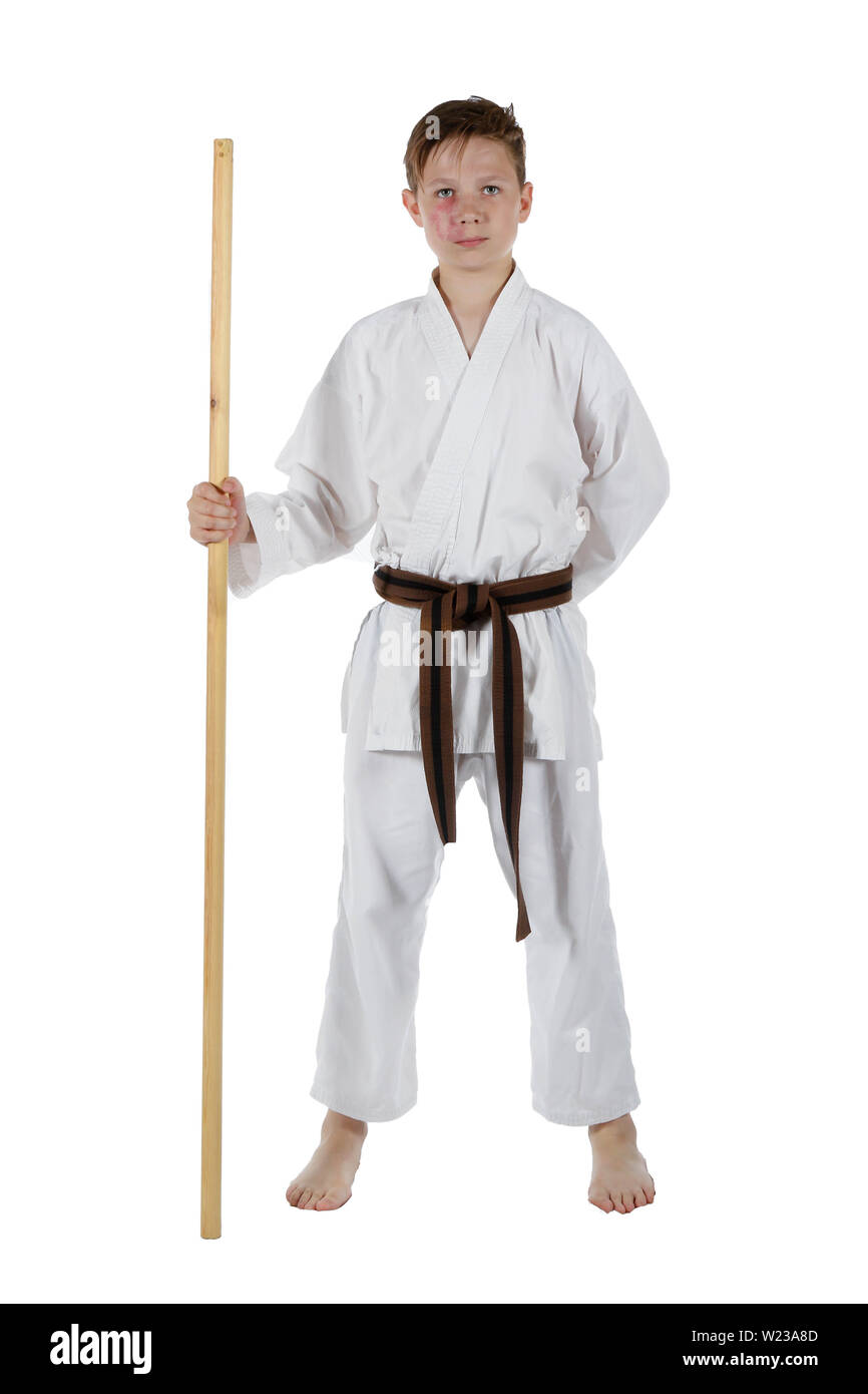 Teenage caucasian boy wearing a karate uniform using a bo Stock Photo ...