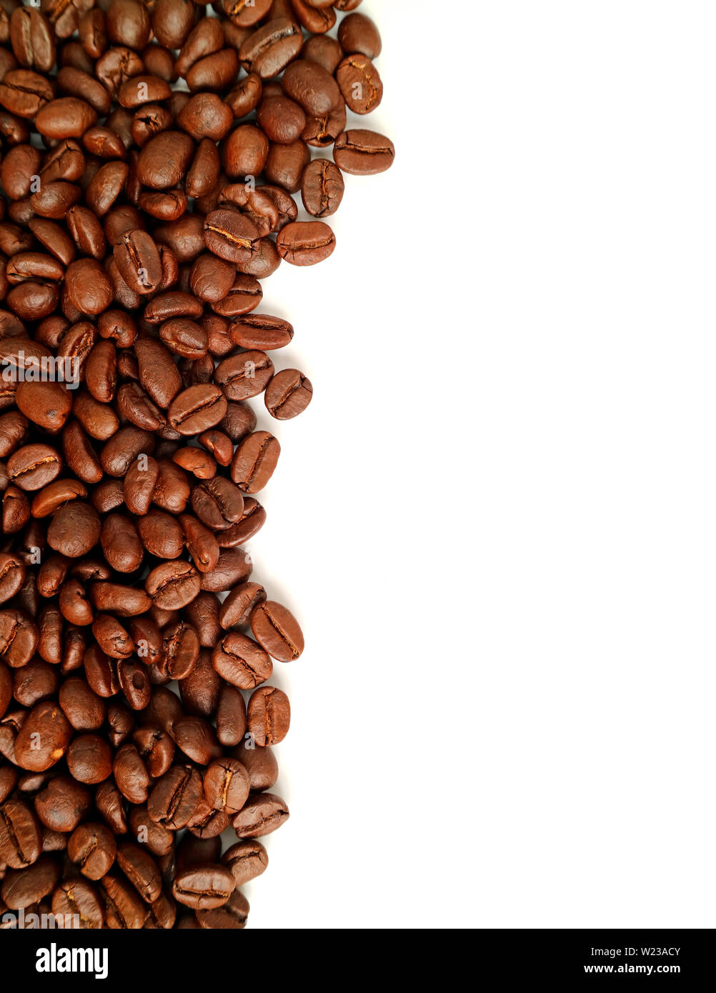 Vertical image of roasted coffee beans isolated on white background ...