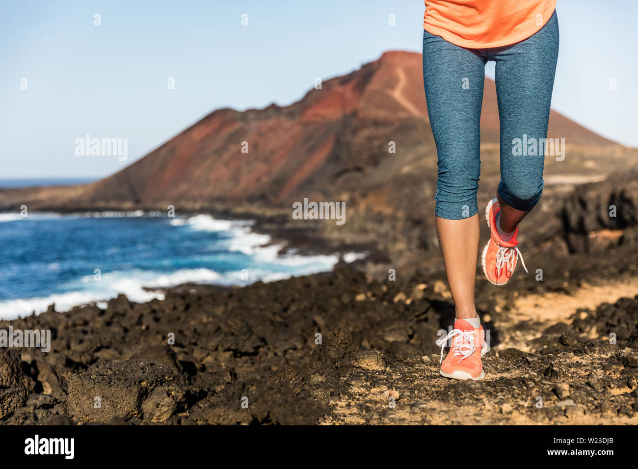 Trail running athlete woman runner legs and shoes lower body. Fitness ...