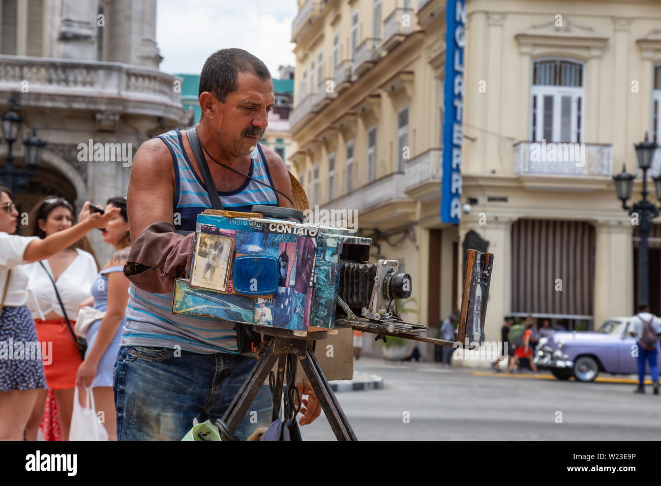 Havana, Cuba - May 29, 2019: Cuban photographer is using a Vintage ...