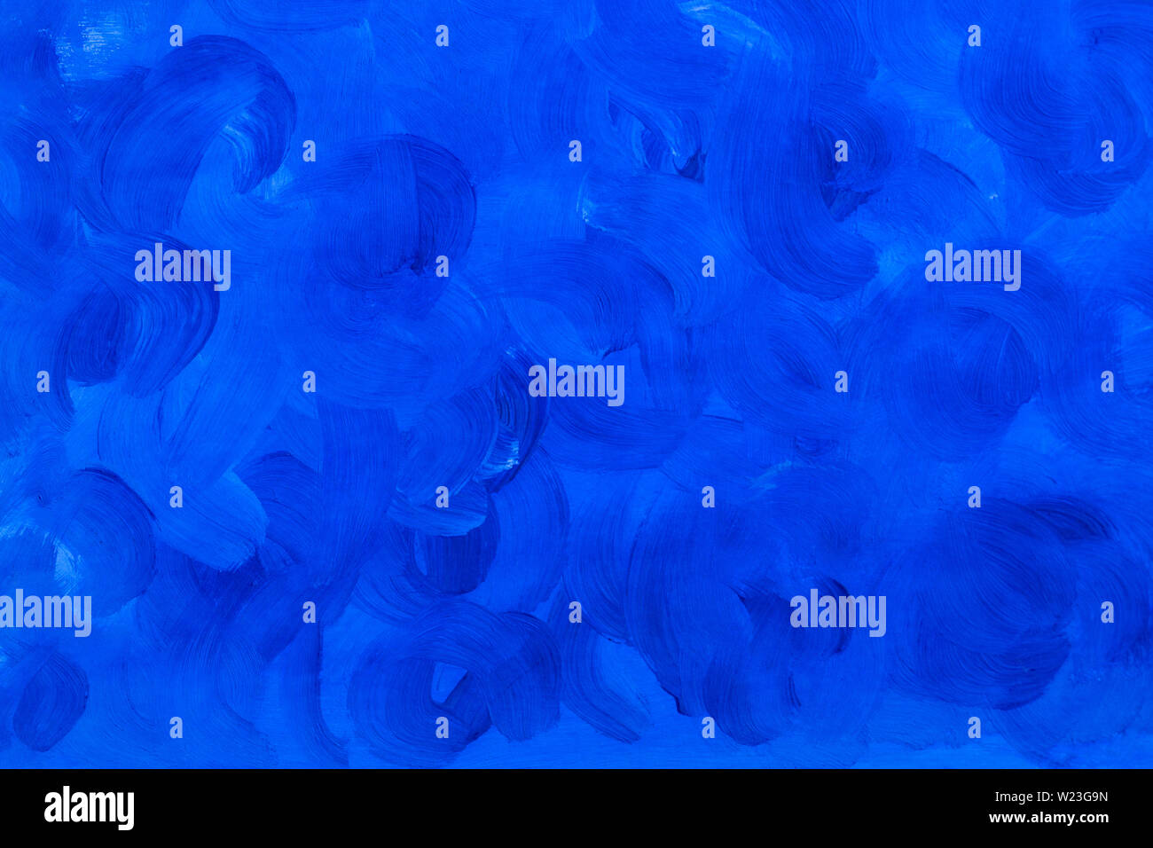 Abstract background drawn by blue acrylic paint in the center is a ...