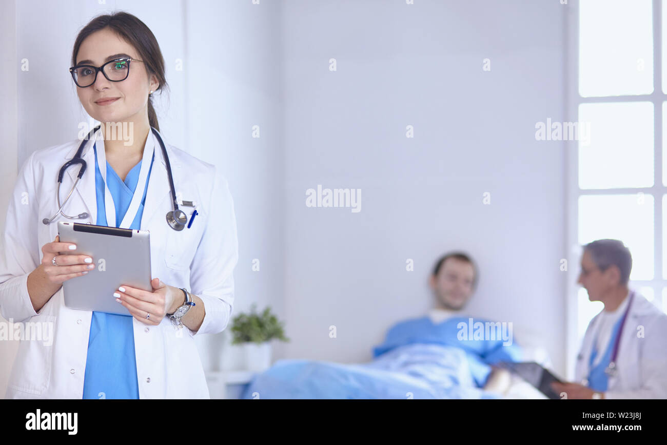 Doctor checking heart beat of patient in bed with stethoscope Stock ...