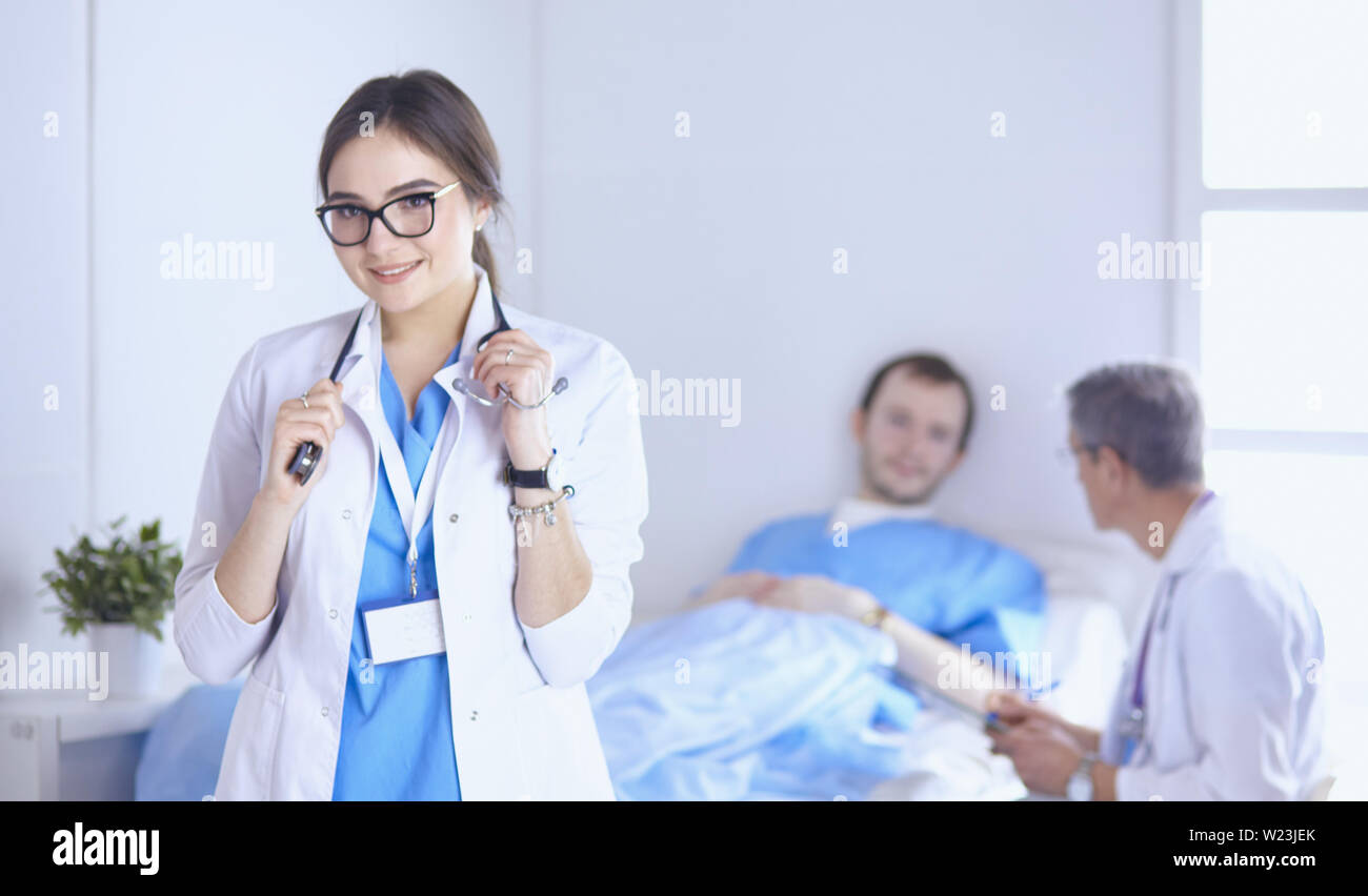 Doctor checking heart beat of patient in bed with stethoscope Stock ...