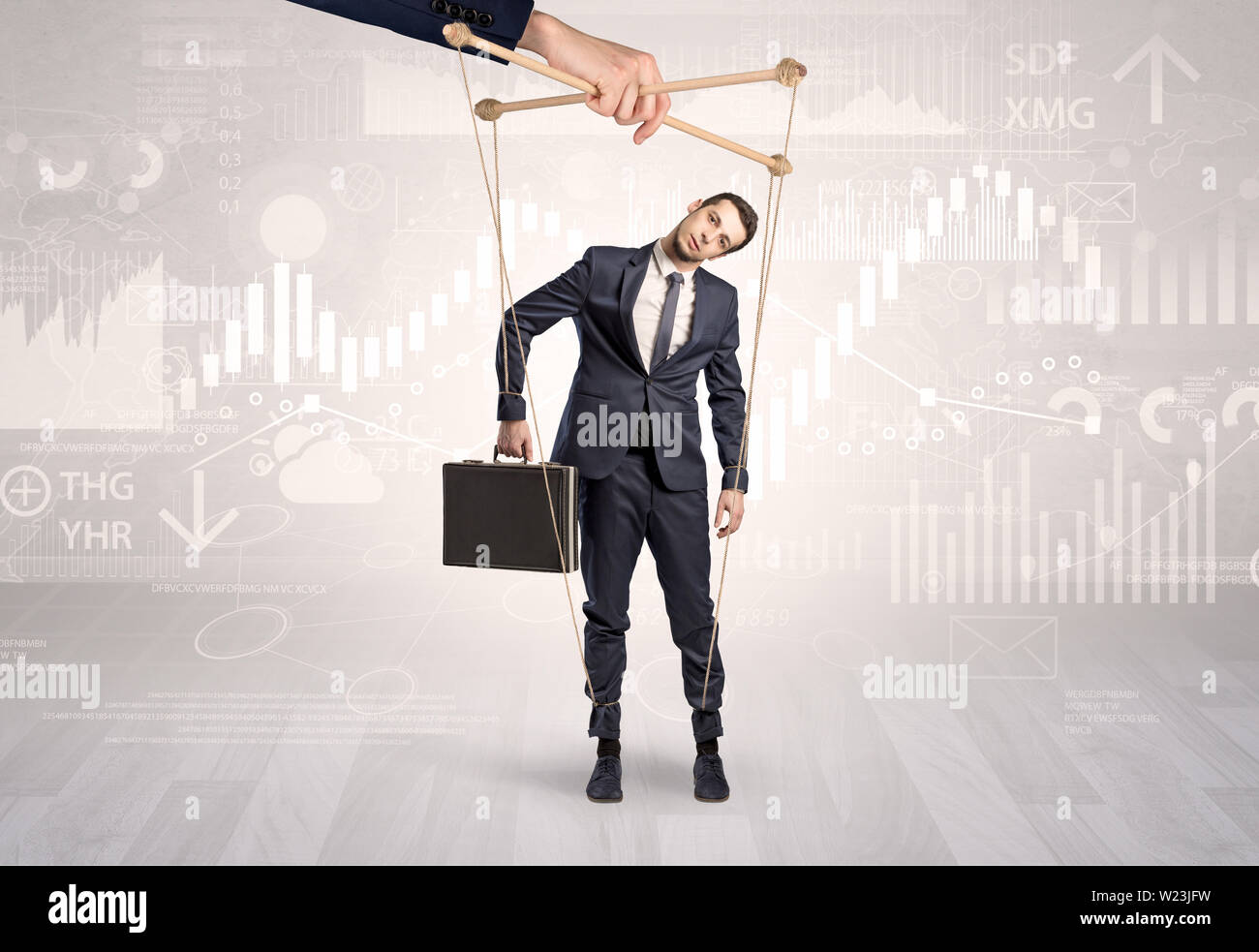 Puppet businessman controlled by another hand with financial concept ...