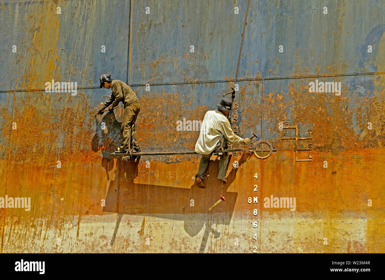 ho chi minh city port, vietnam - november 07, 2008: shipyard workes ...