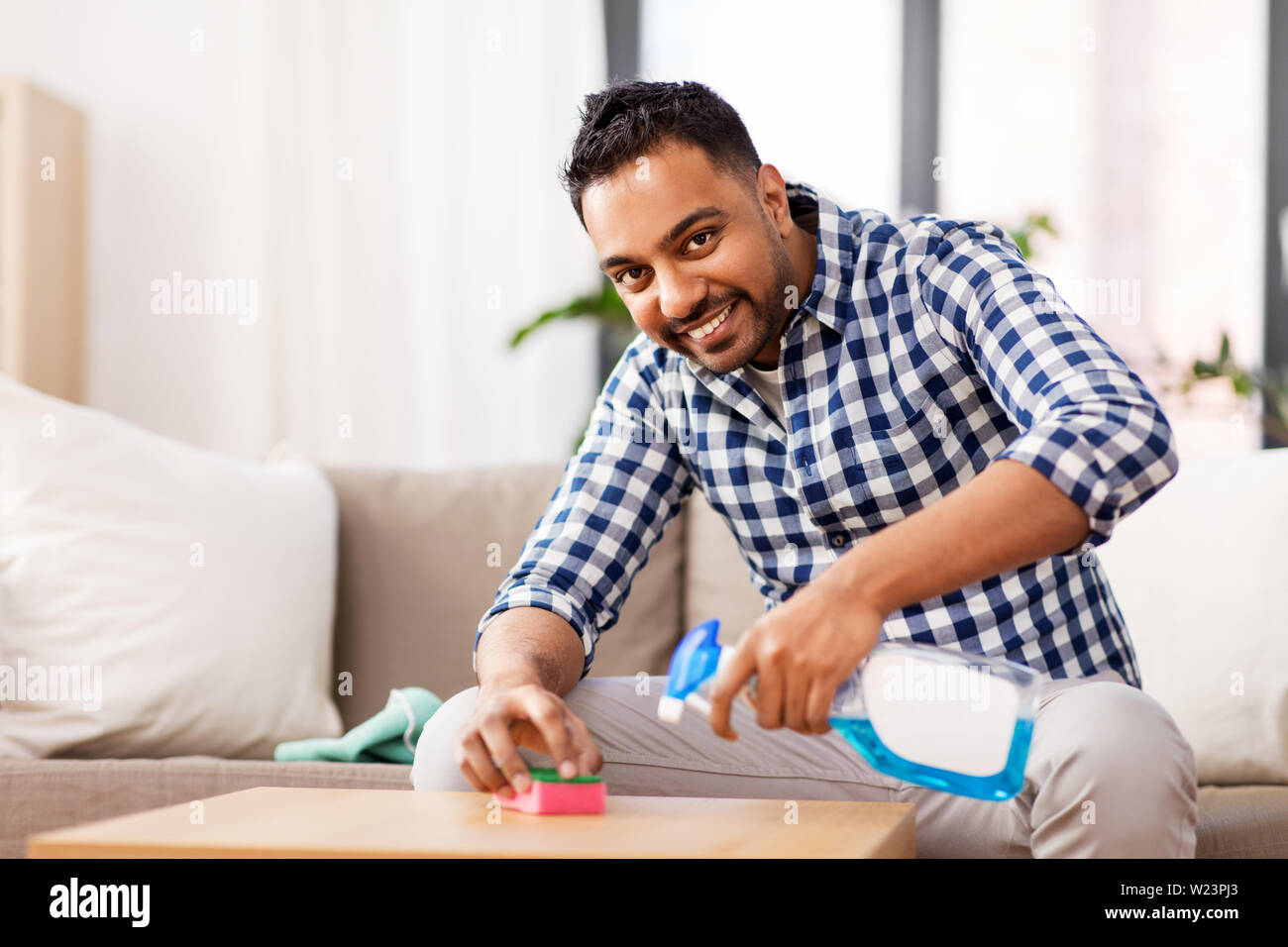 indian man cleaning table with detergent at home Stock Photo - Alamy
