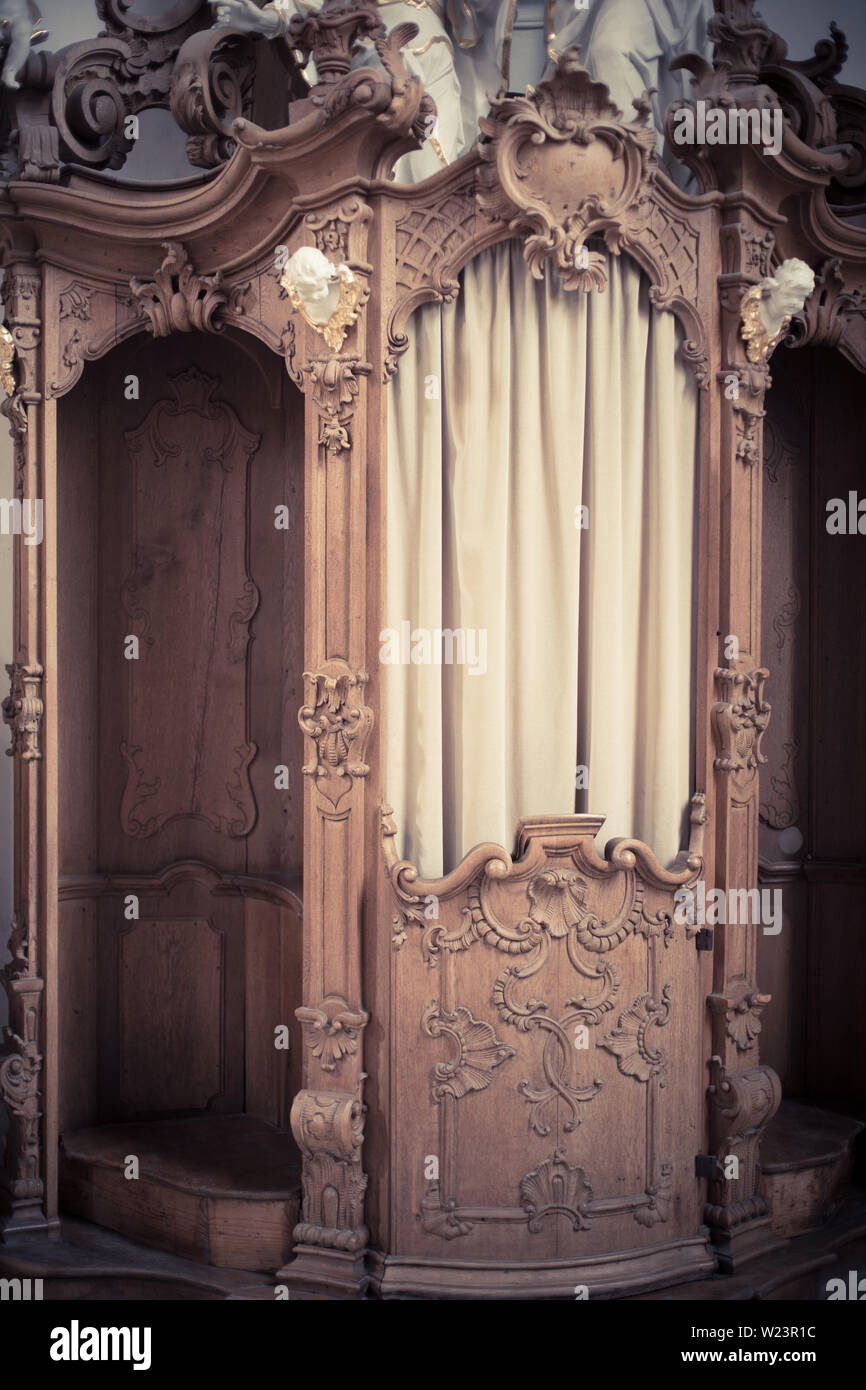 Image of a old wooden confessional in a church Stock Photo - Alamy