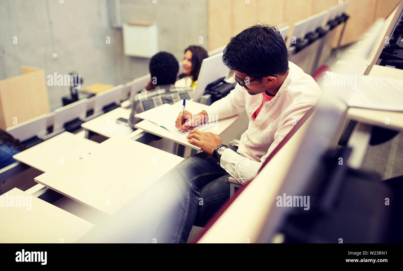 group of students with notebooks in lecture hall Stock Photo - Alamy