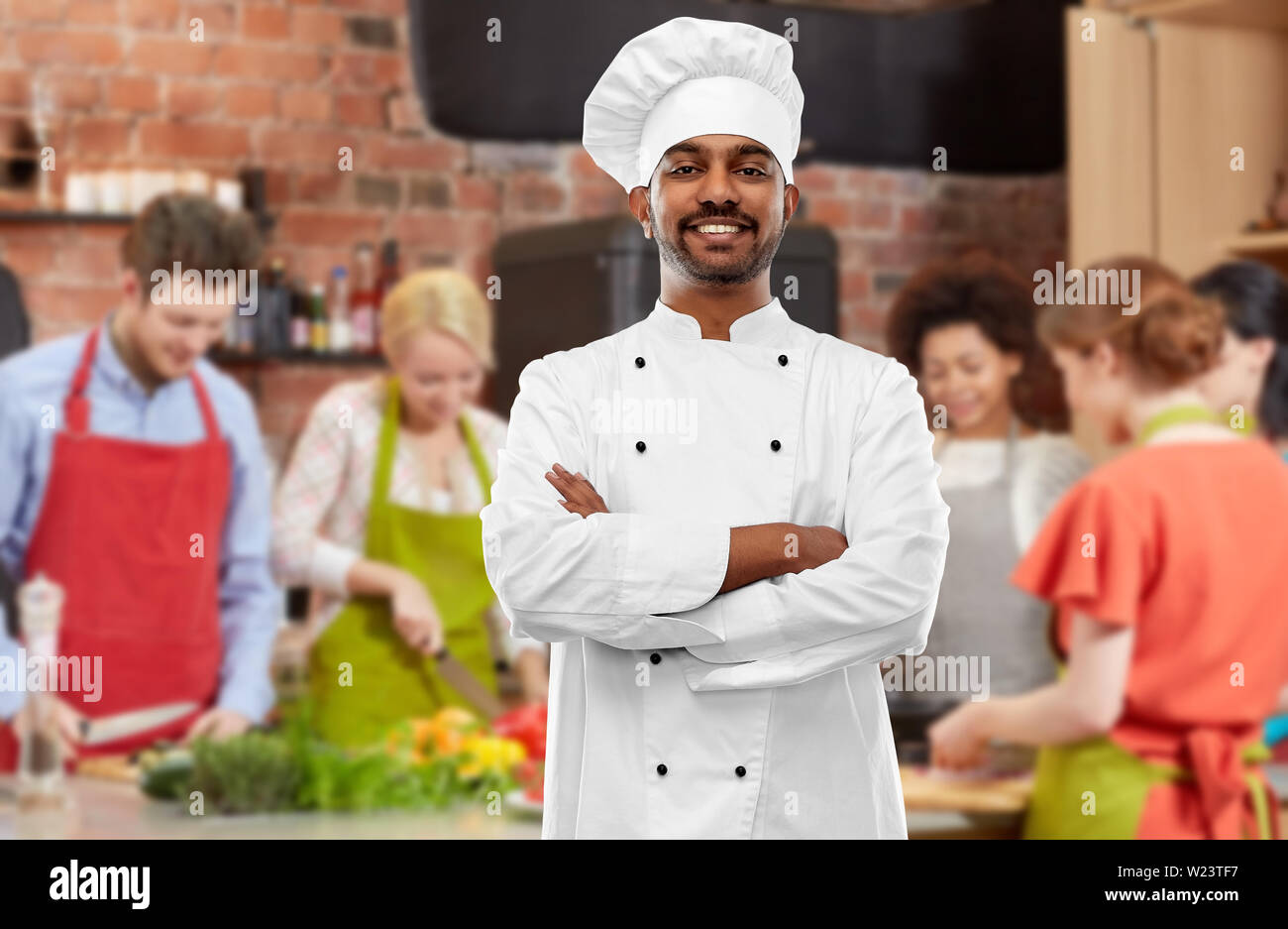 happy male indian chef in toque at cooking class Stock Photo - Alamy