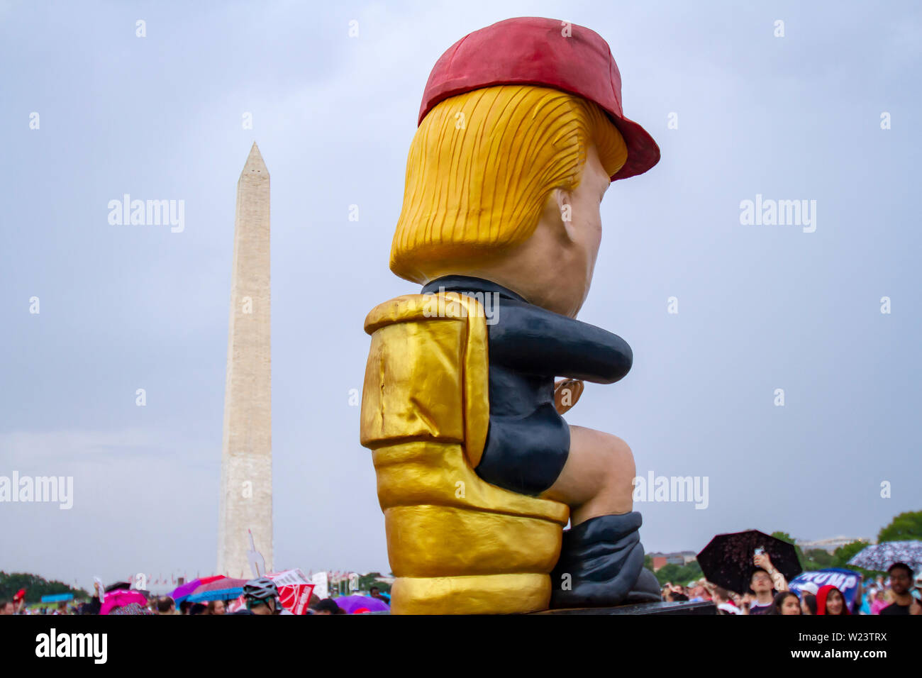 An effigy of Donald Trump looms over the crowd amid protests on ...