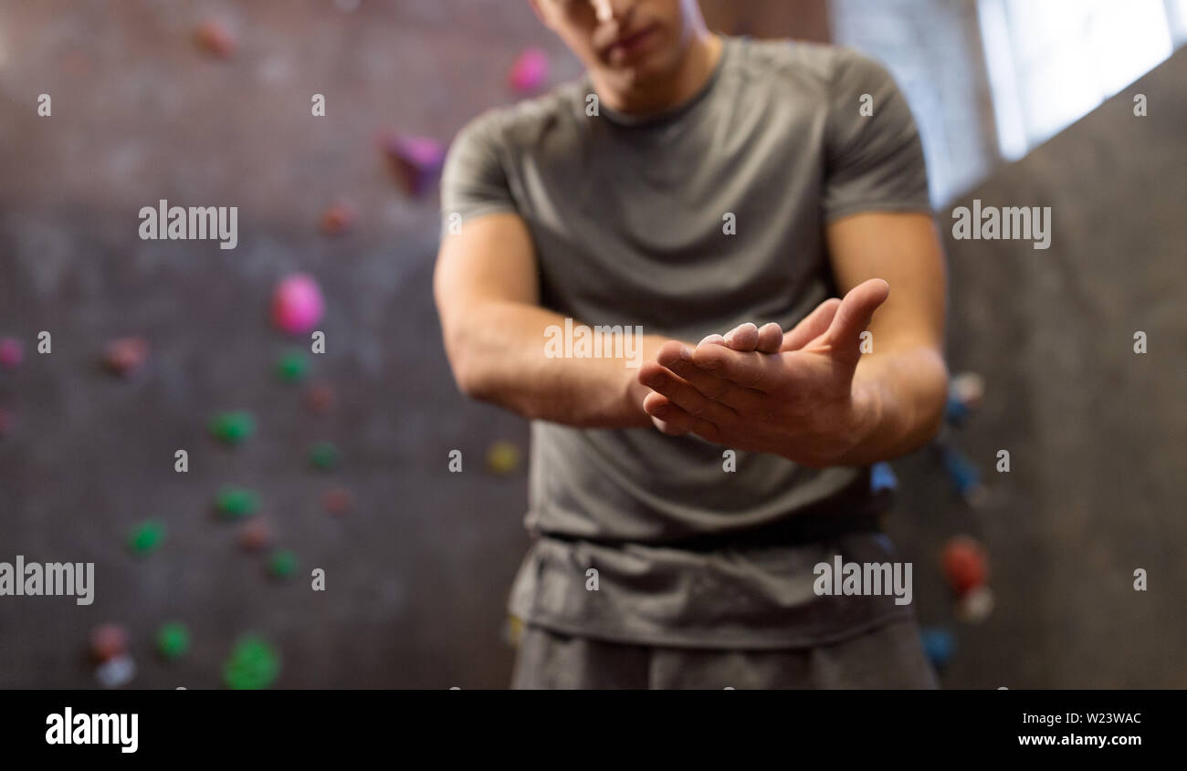 male climber drying hands at indoor climbing gym Stock Photo - Alamy