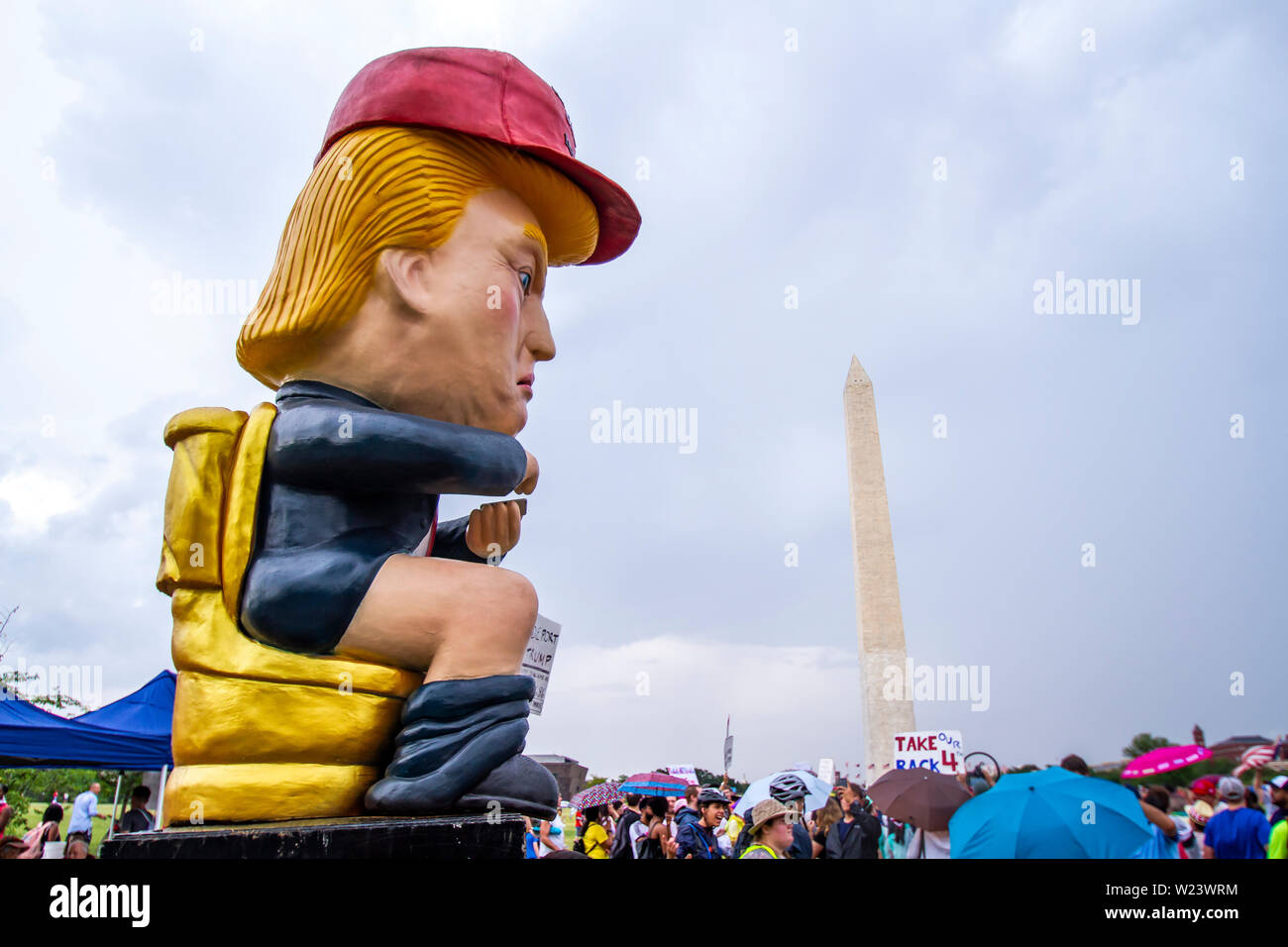 An effigy of Donald Trump looms over the crowd amid protests on ...