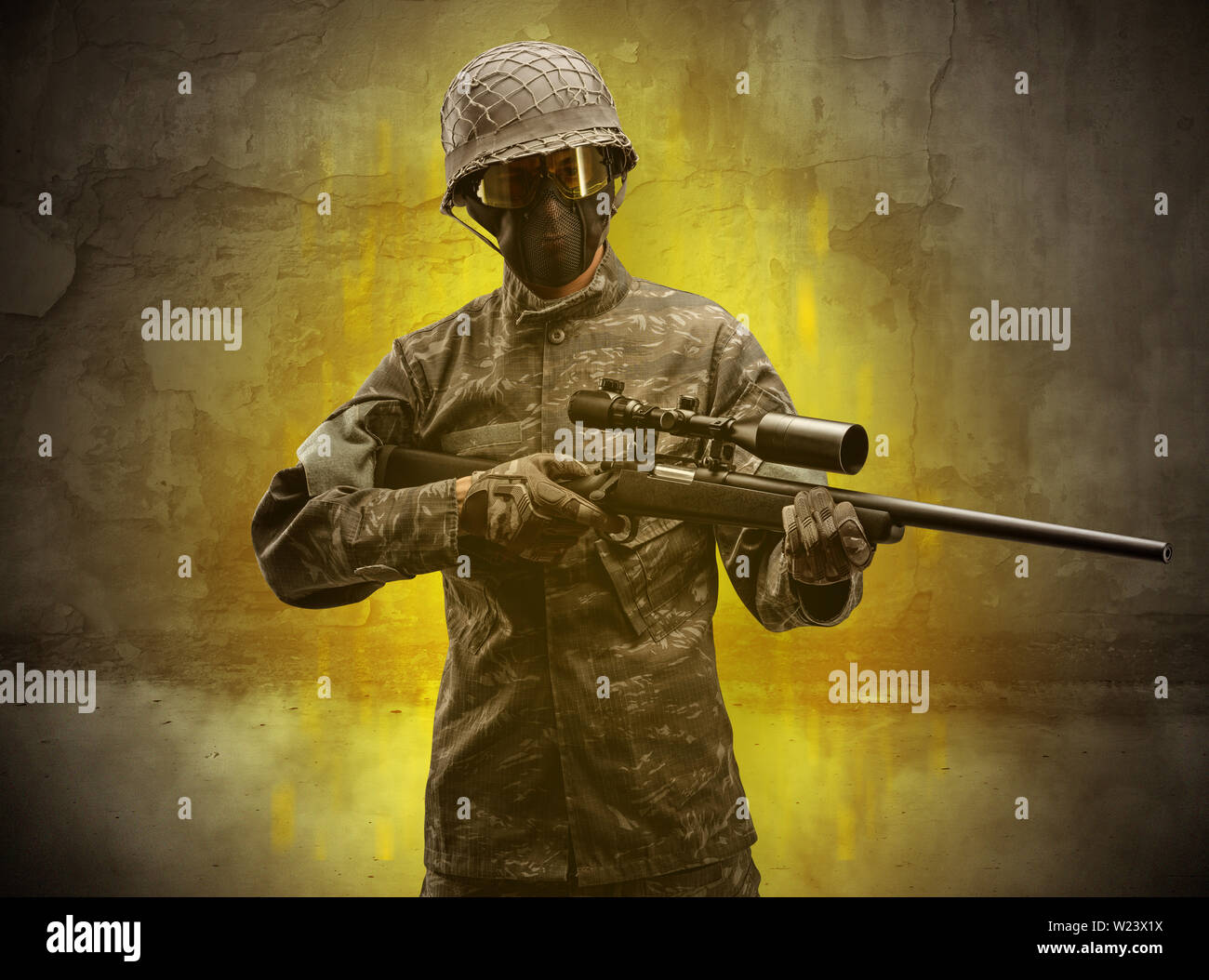 Hazard, menace soldier in a ruined crumbly building with arms on his ...