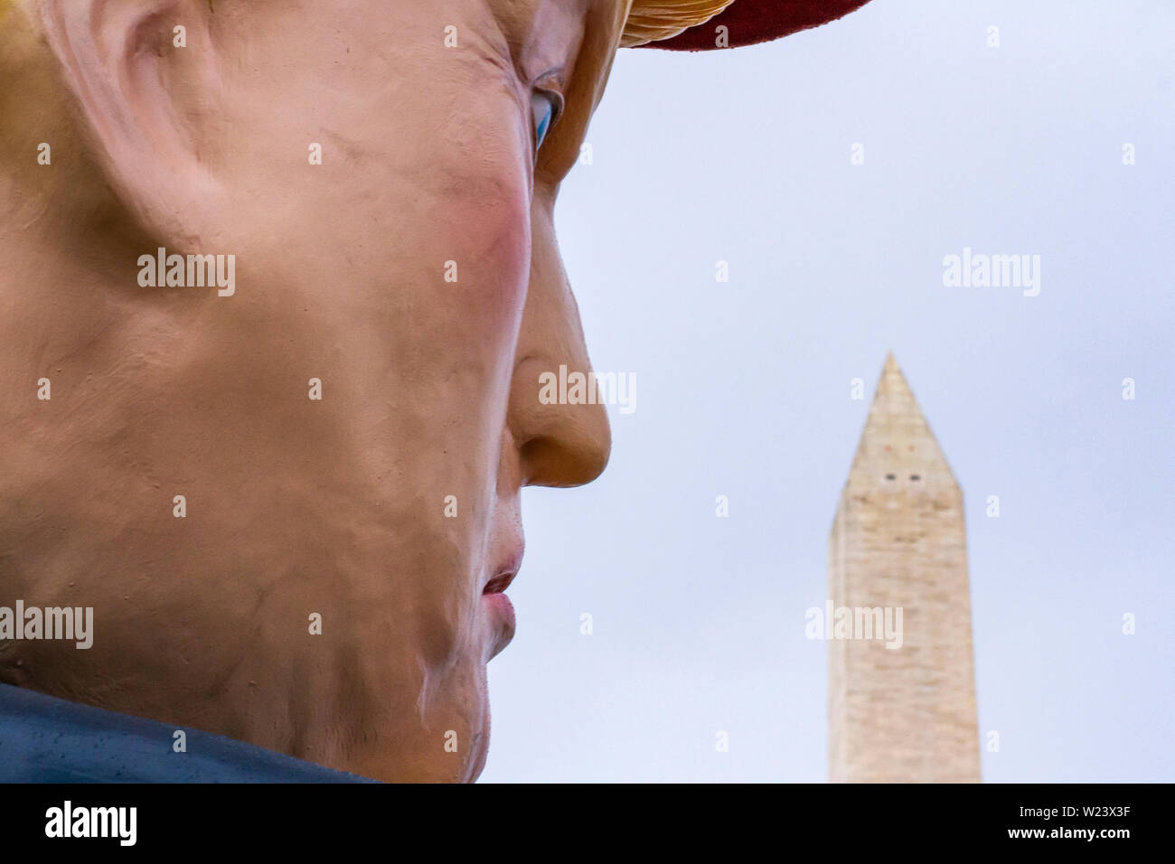 An effigy of Donald Trump looms over the crowd amid protests on ...