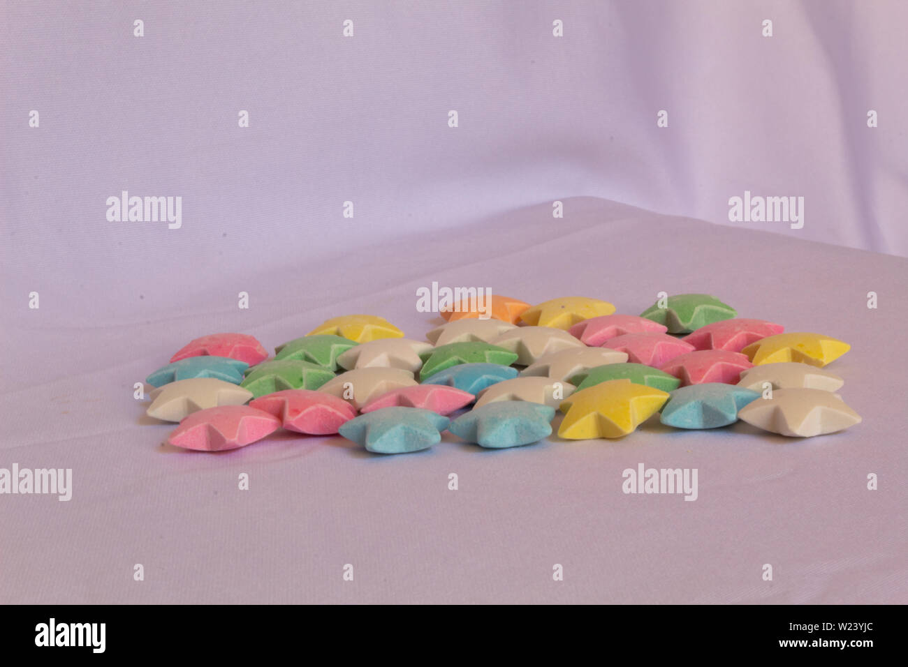 Many candies with different shapes on a white background Stock Photo ...