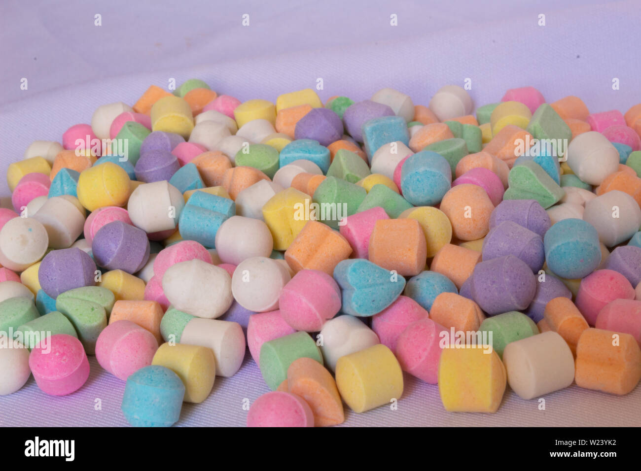 Many candies with different shapes on a white background Stock Photo ...