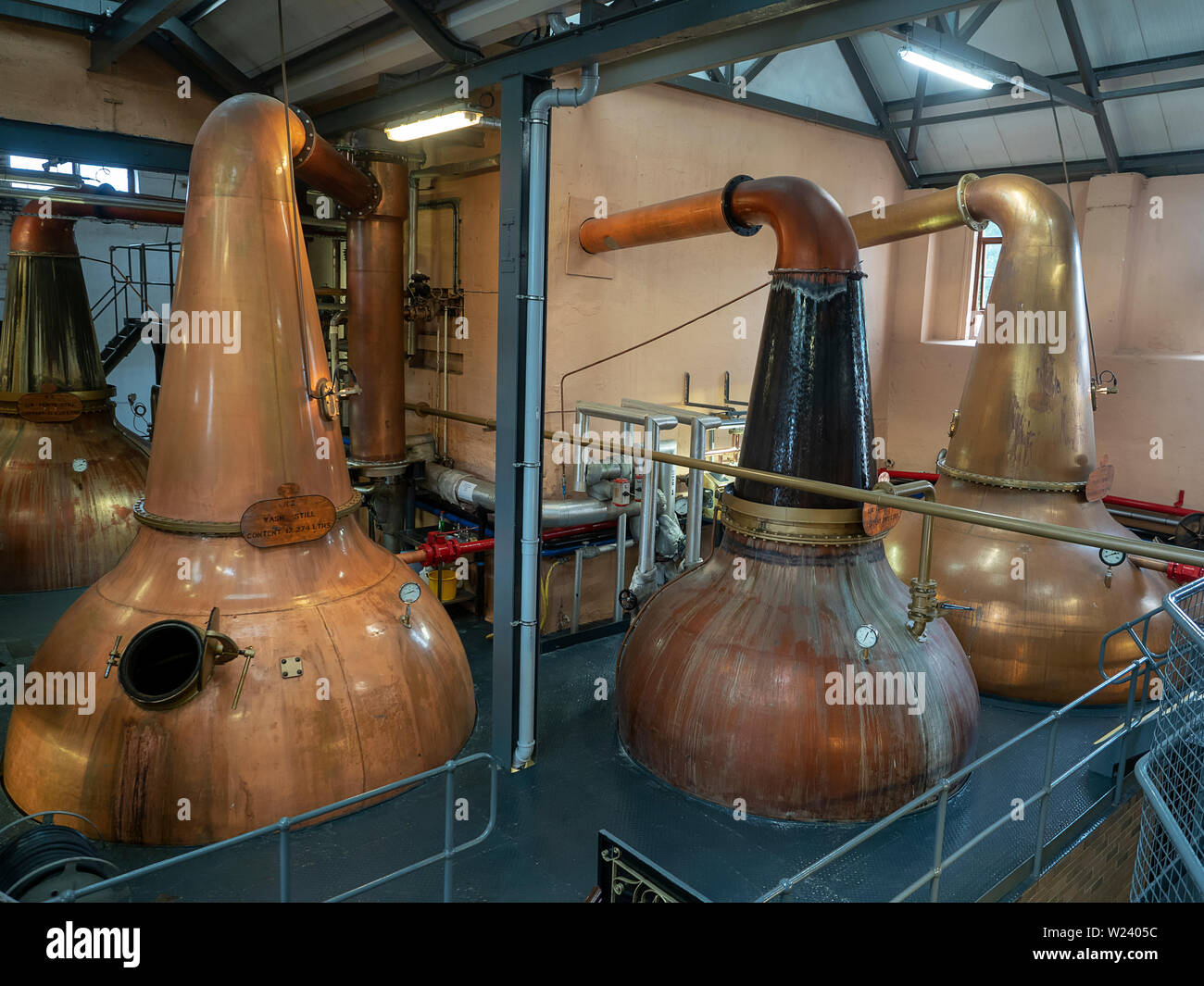 Whisky stills at a distillery in Scotland Stock Photo - Alamy