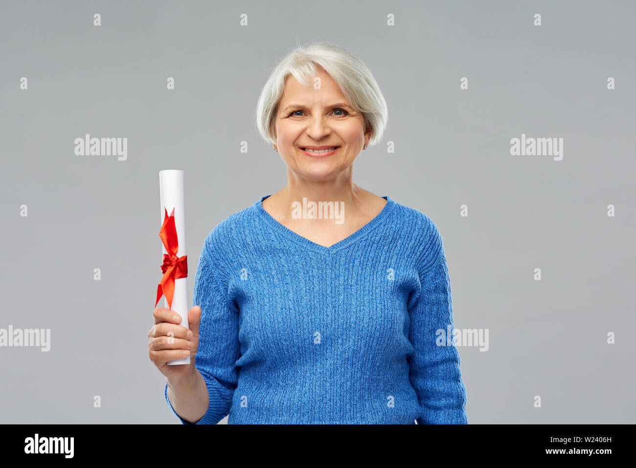 happy senior graduate student woman with diploma Stock Photo - Alamy