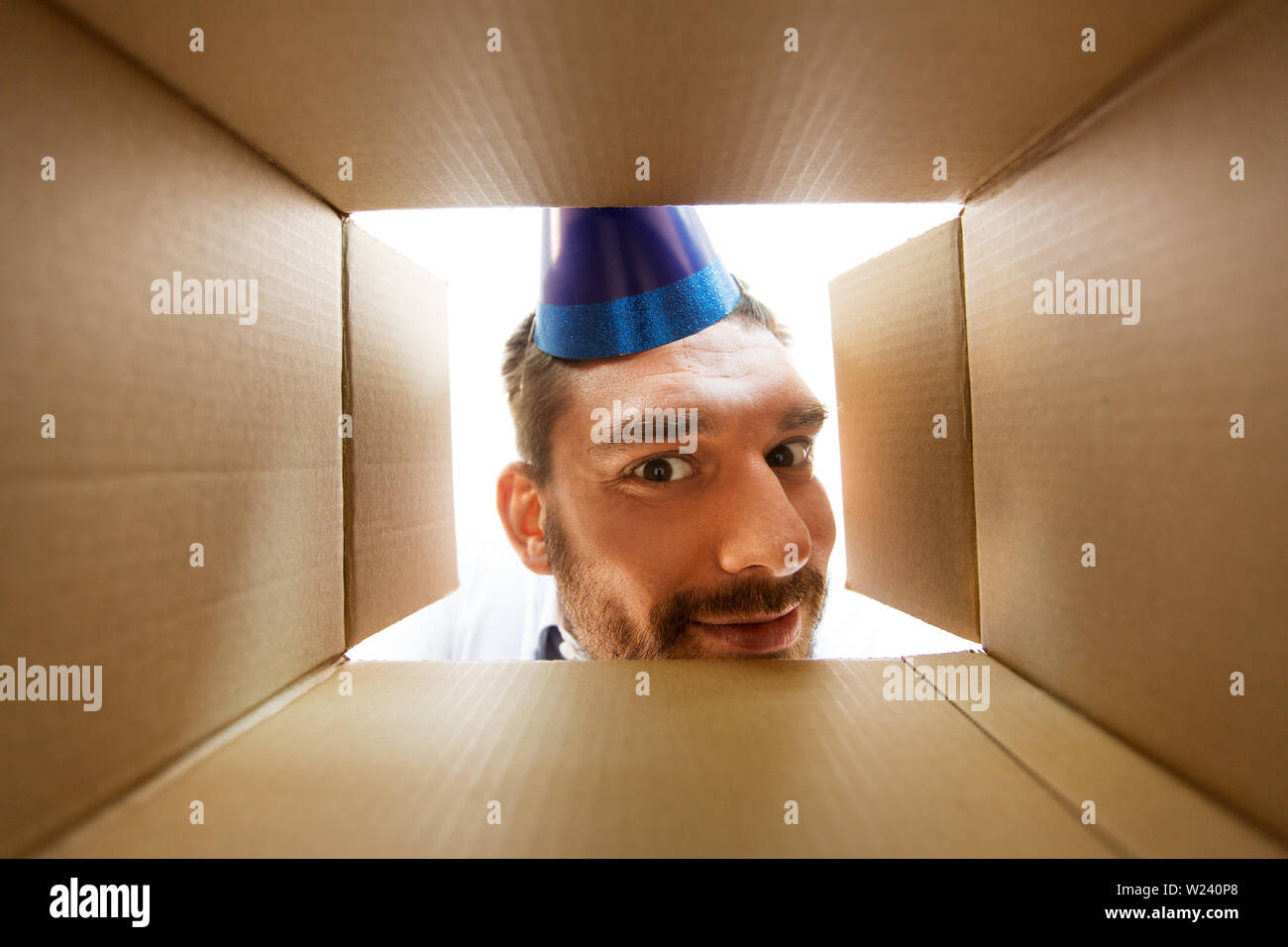 happy man opening parcel box or birthday gift Stock Photo - Alamy