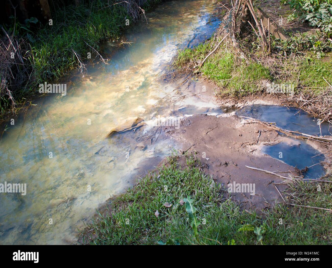Polluted water on land adjacent to a former chemical factory. This is ...