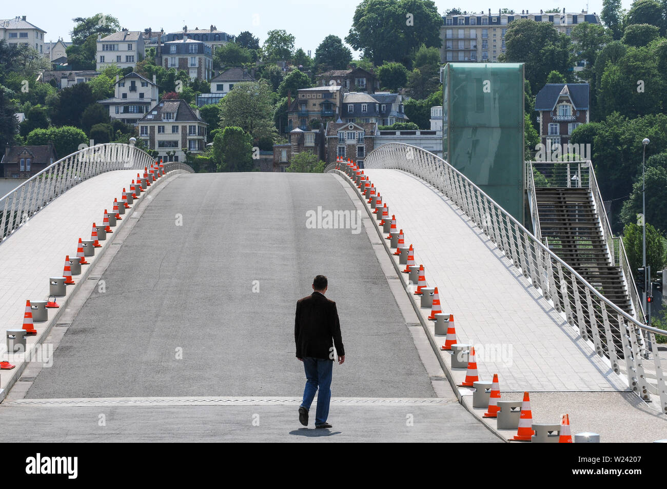 Man standing on a bridge, Paris, France Stock Photo - Alamy
