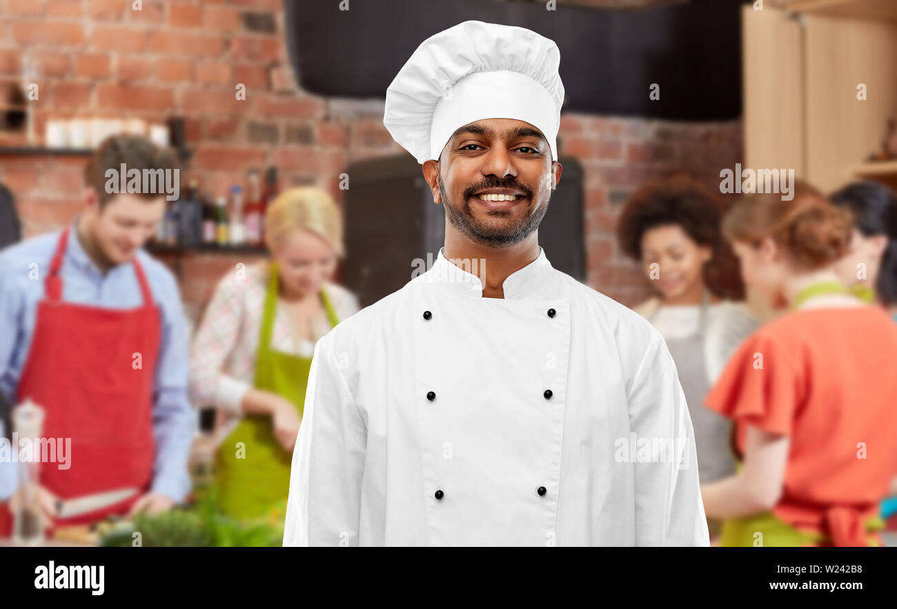happy male indian chef in toque at cooking class Stock Photo - Alamy