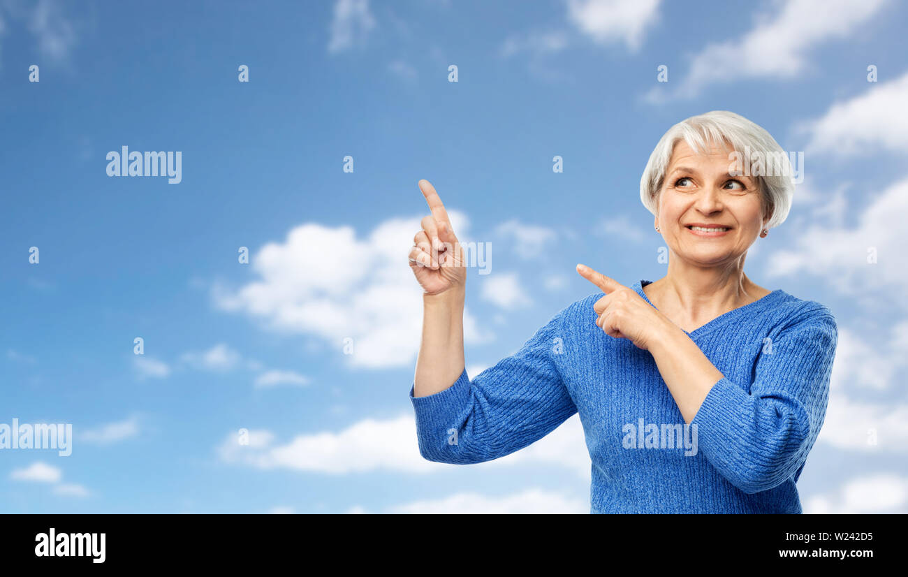 Woman pointing at sky hi-res stock photography and images - Alamy