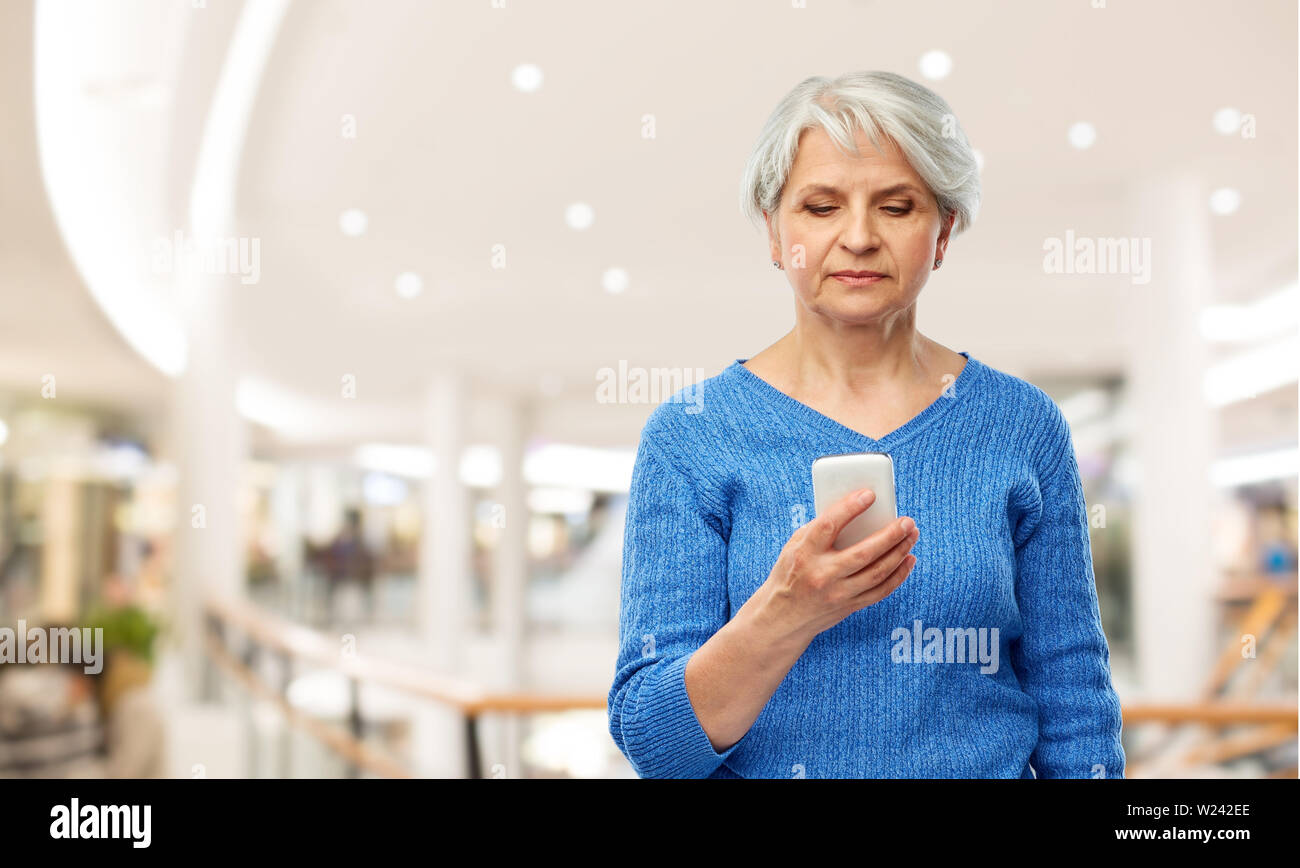 Serious older woman using hi-res stock photography and images - Alamy
