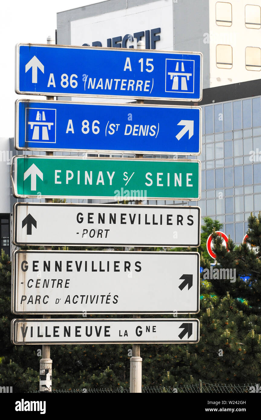 Directional boards on a roadway located along the Seine, Paris, France ...