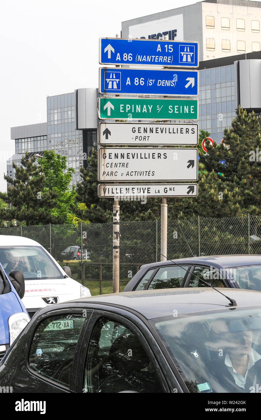 Directional boards on a roadway located along the Seine, Paris, France ...
