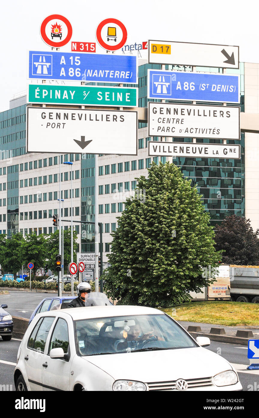 Directional boards on a roadway located along the Seine, Paris, France ...