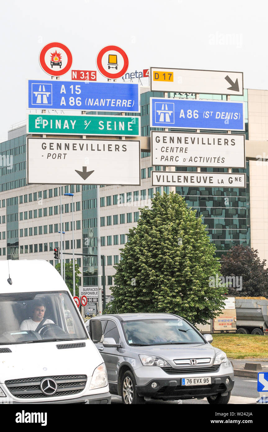 Directional boards on a roadway located along the Seine, Paris, France ...