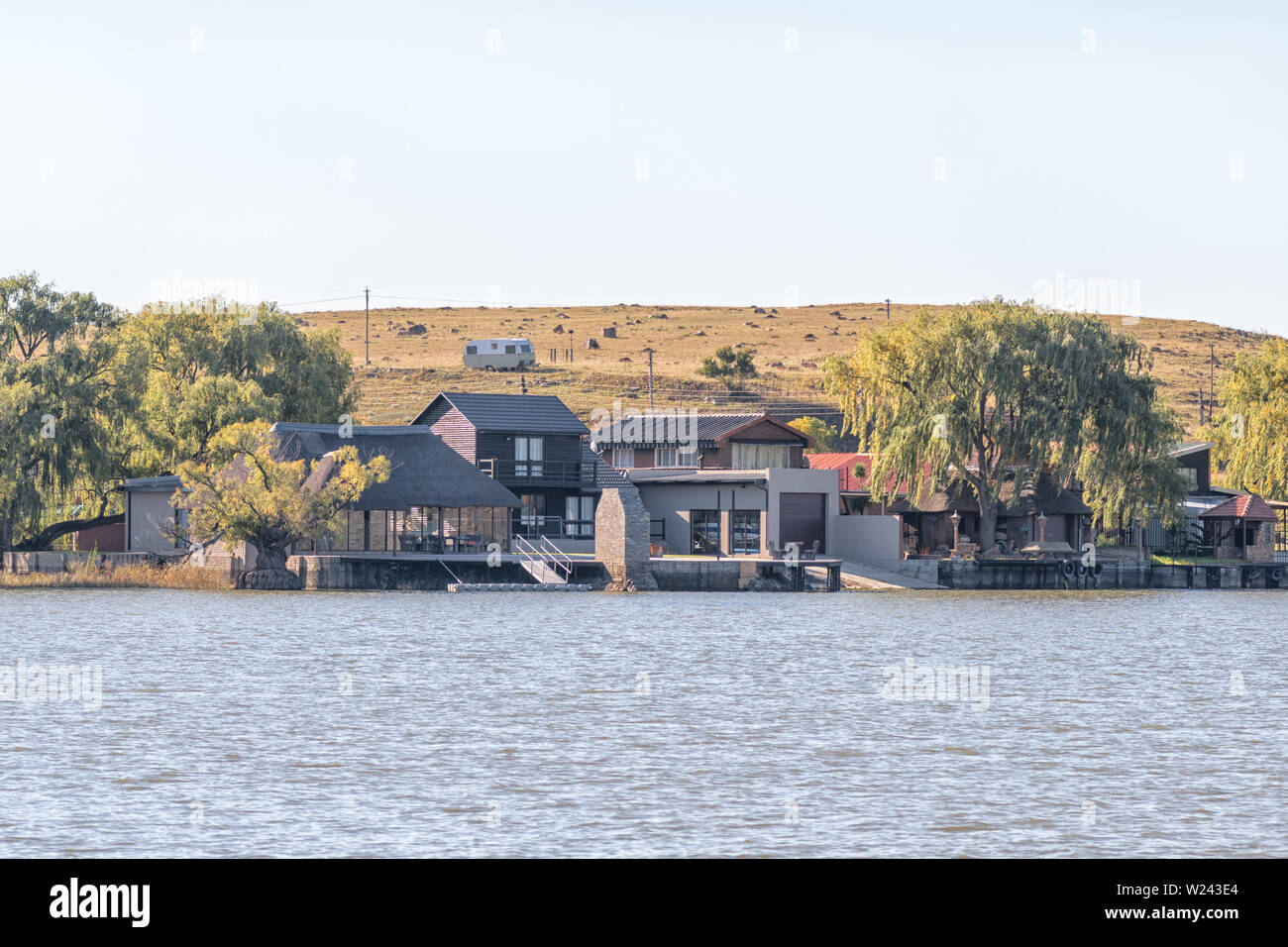 VREDE, SOUTH AFRICA - MAY 1, 2019: Holiday homes next to the dam at ...