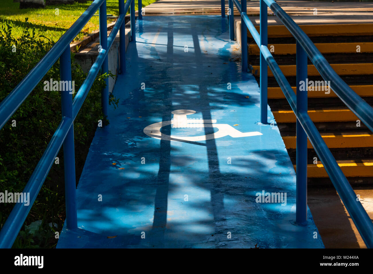 Ramp symbol for disabled people in a wheelchair Stock Photo - Alamy