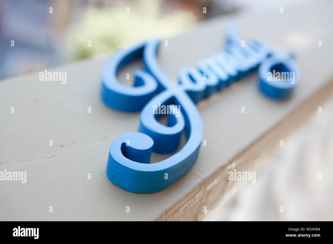 Closeup wooden word family blue on a light surface, soft focus Stock ...