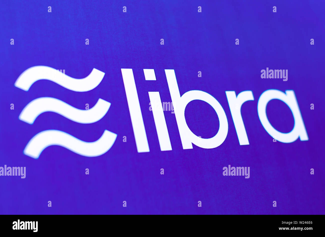 Facebook Libra logo on a printed brochure. Close up photos with shallow ...