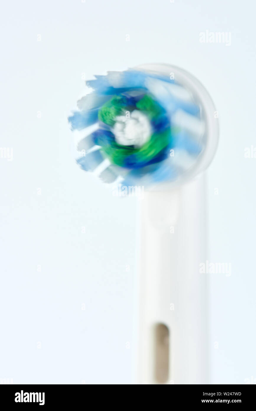 Spinning toothbrush head isolated on white background Stock Photo - Alamy