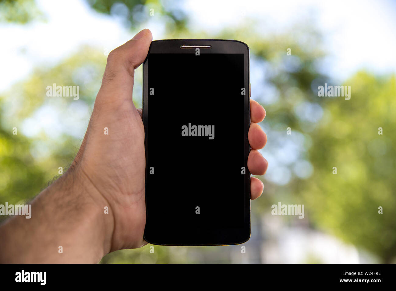 plain smartphone with black text field in the nature Stock Photo - Alamy