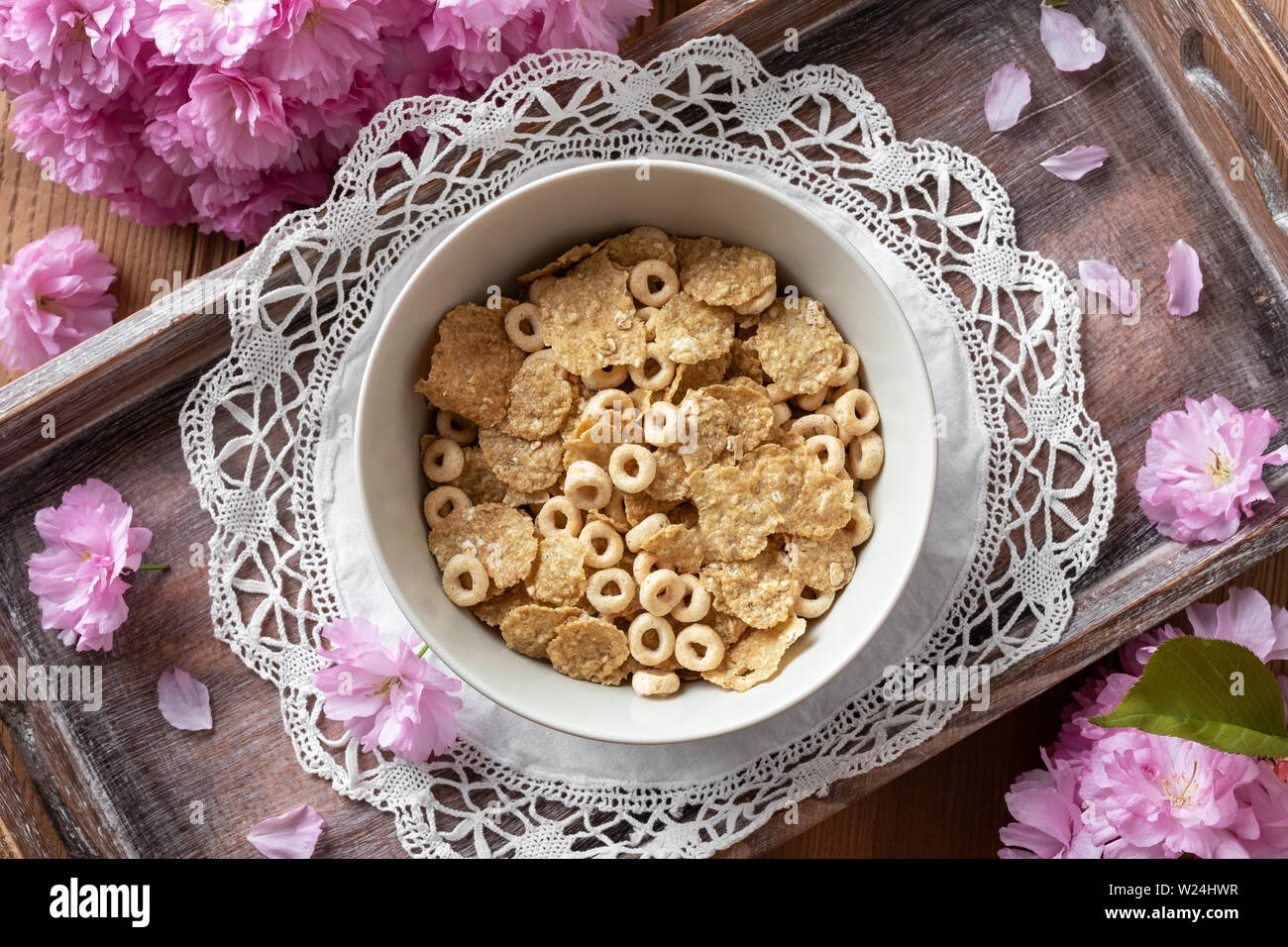 Breakfast cereals with pink kwanzan cherry blossoms, top view Stock ...