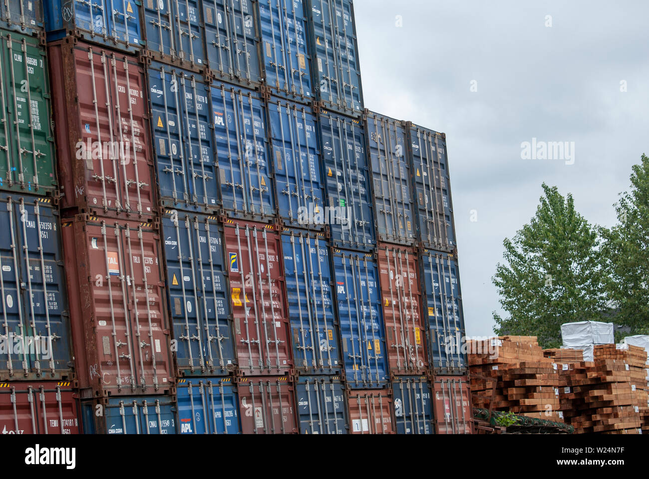 Piles of containers at commercial transit station Stock Photo - Alamy