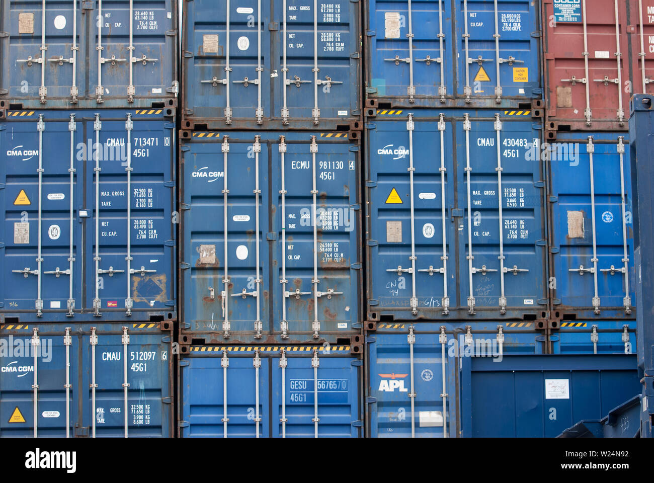 Piles of containers at commercial transit station Stock Photo - Alamy