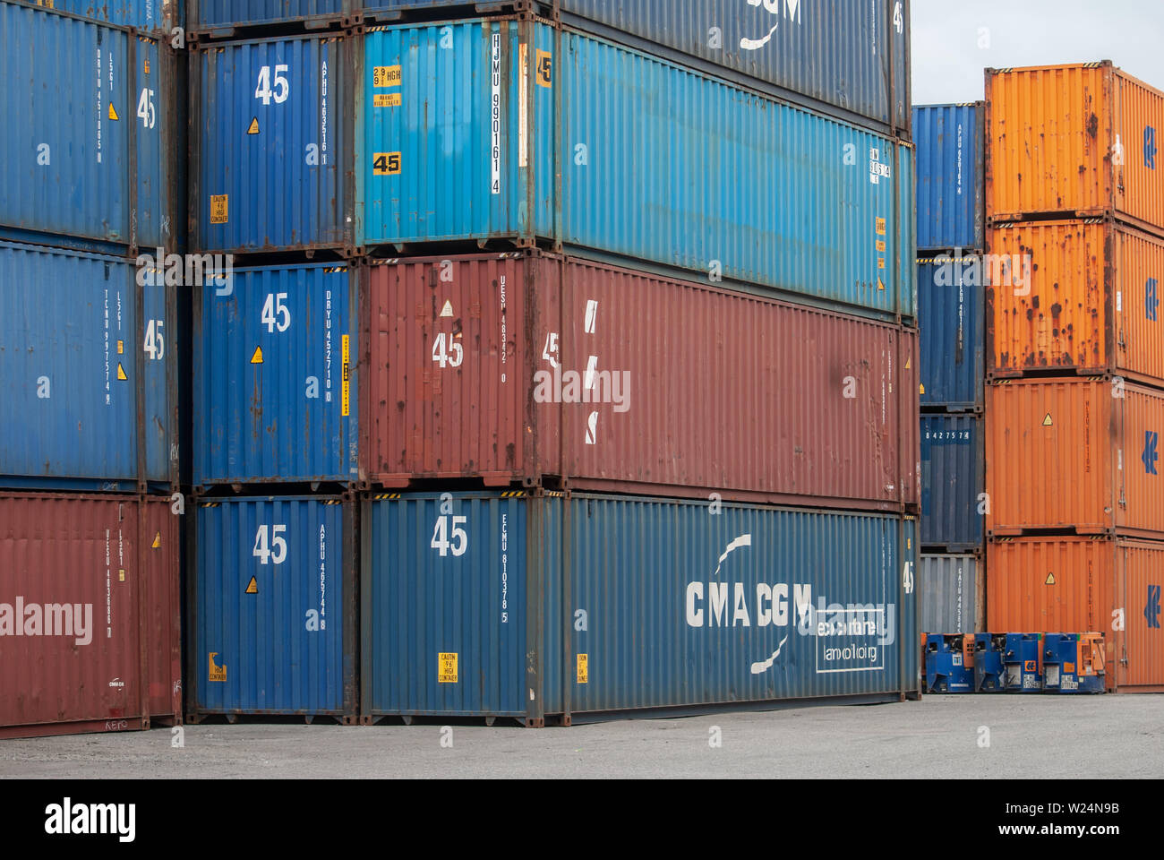 Piles of containers at commercial transit station Stock Photo - Alamy