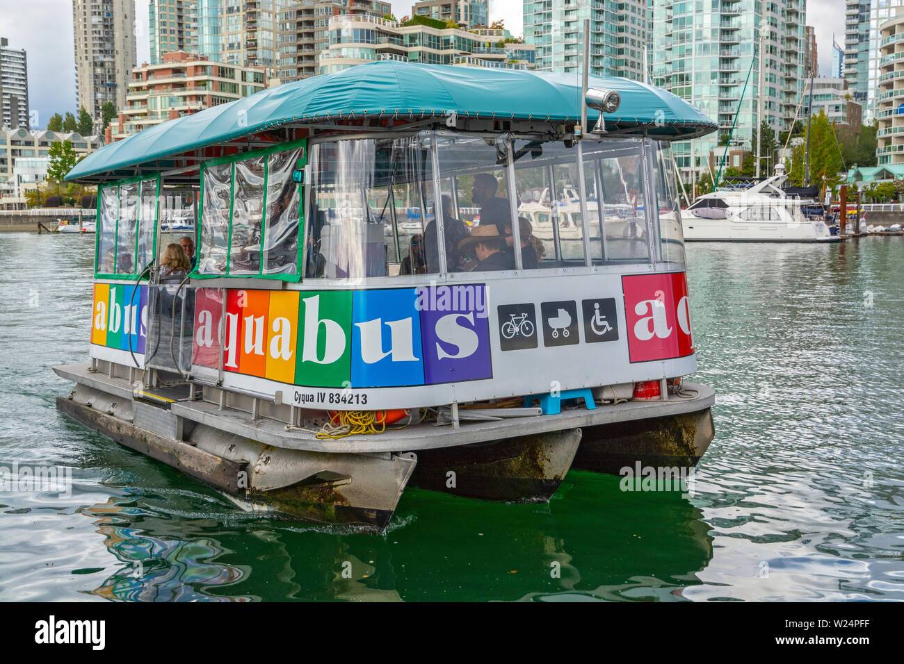 Canada, British Columbia, Vancouver, False Creek, Aquabus approaching ...